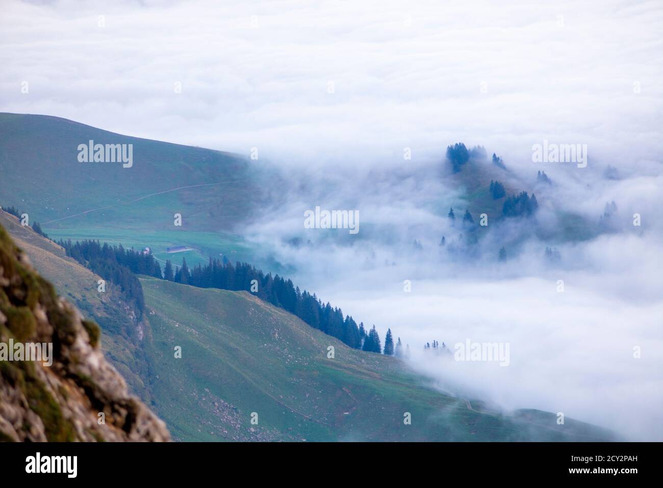 Colorful sunrise on the clouds and steep ridge of the majestic ...