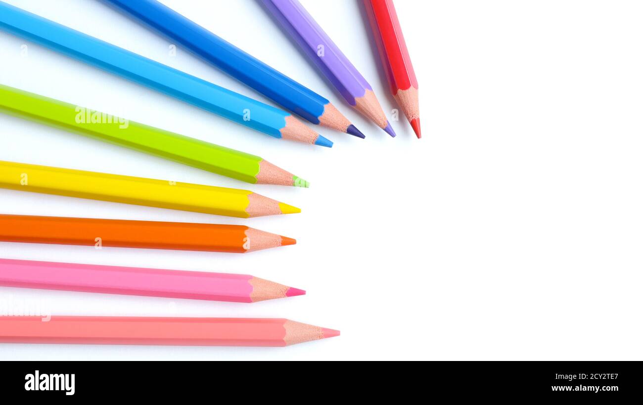 Red, orange, yellow, green, blue, pink color pencils close-up isolated ...