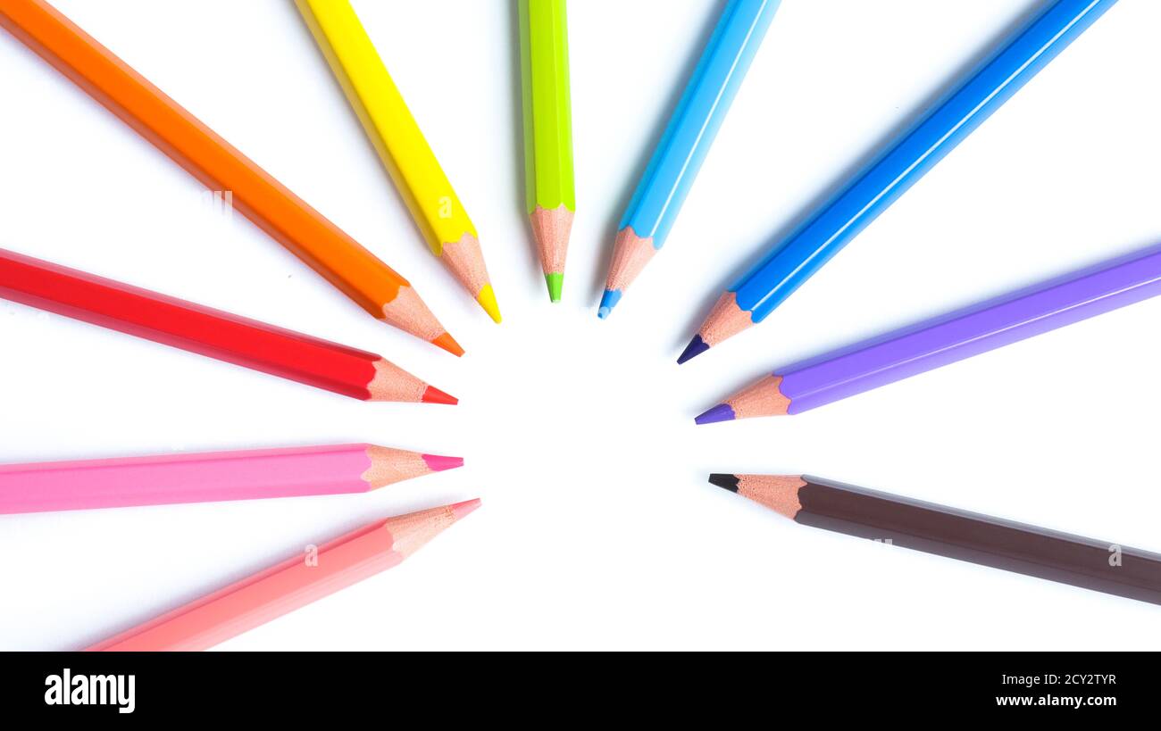 Red, orange, yellow, green, blue, pink color pencils close-up isolated ...