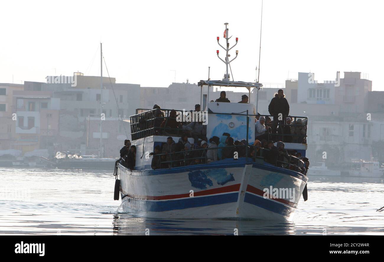 Migrants immigrants small boat hi-res stock photography and images - Alamy
