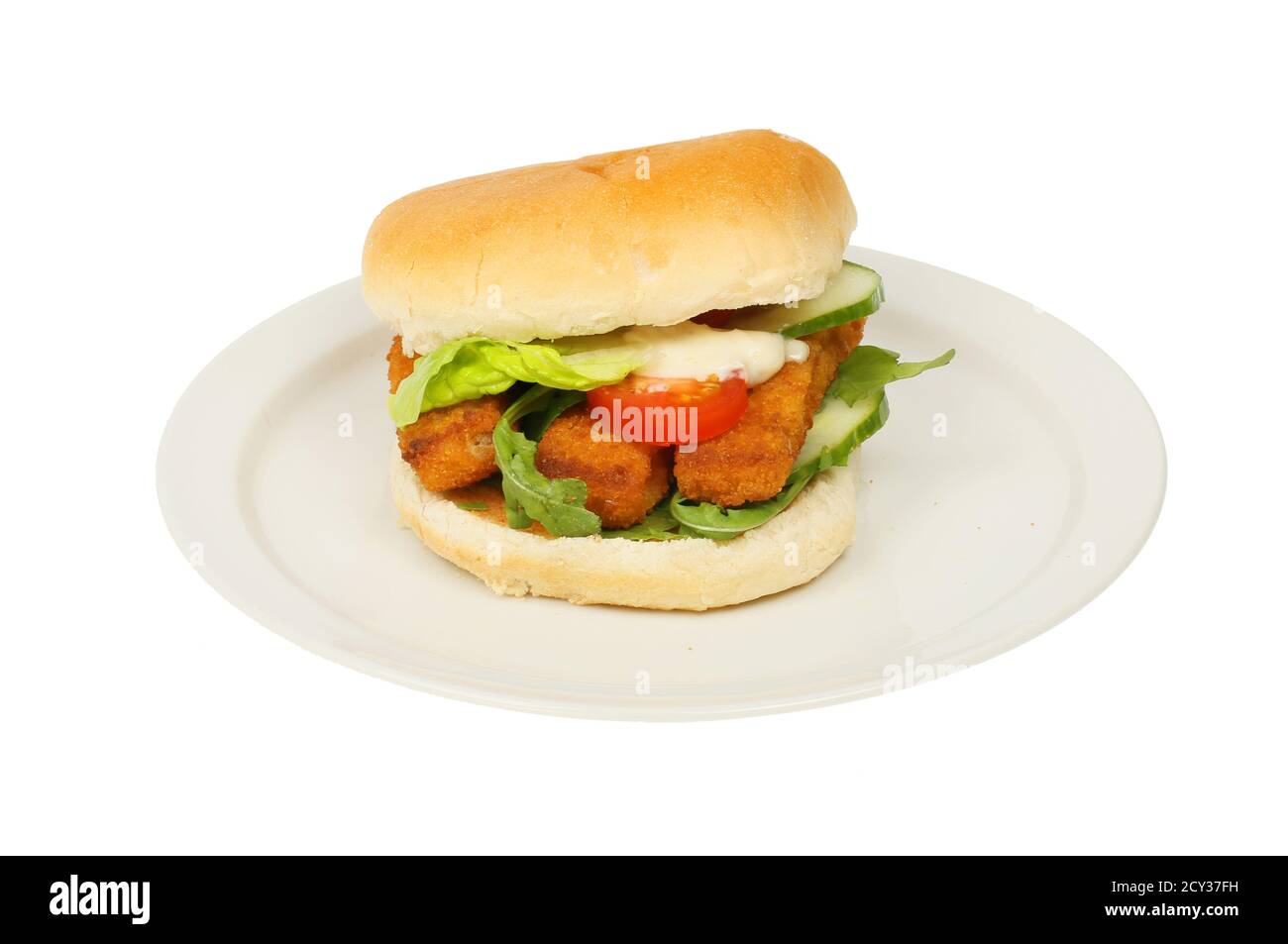 Fish fingers and salad in a roll on a plate isolated against white ...