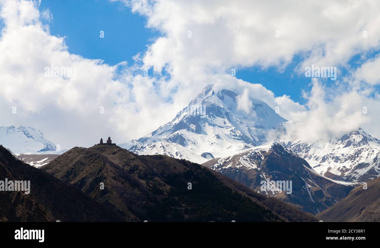 Mount Kazbek. Georgian mountain landscape with Gergeti Trinity Church ...