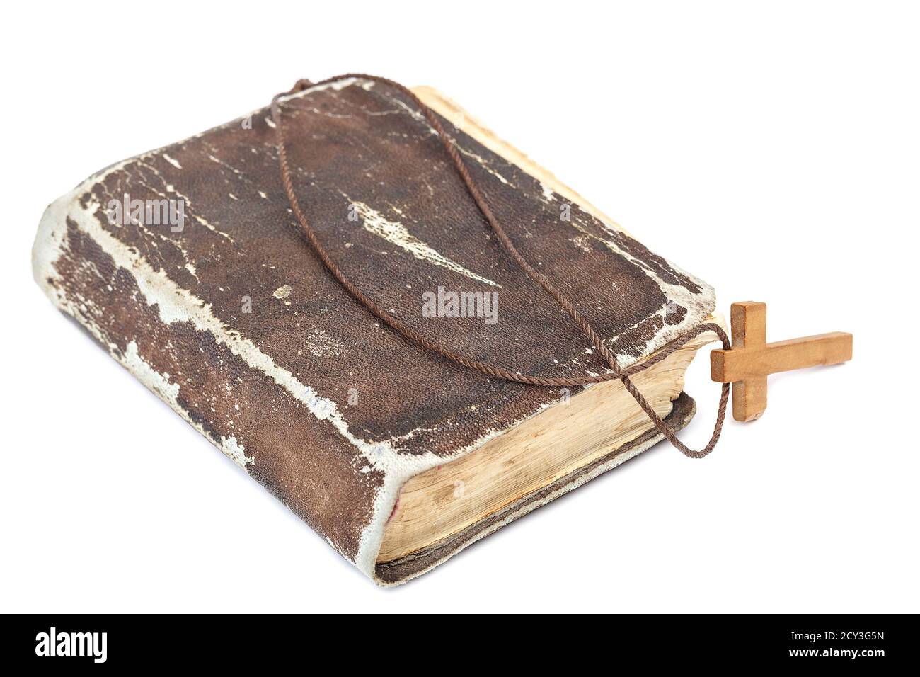 Ancient holy book of a wooden cross on a cord isolated on a white ...