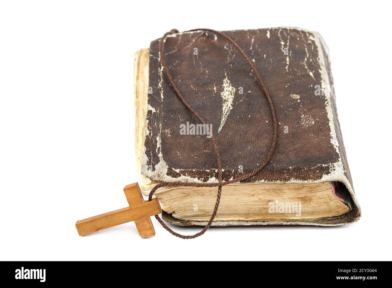 Ancient holy book of a wooden cross on a cord isolated on a white ...