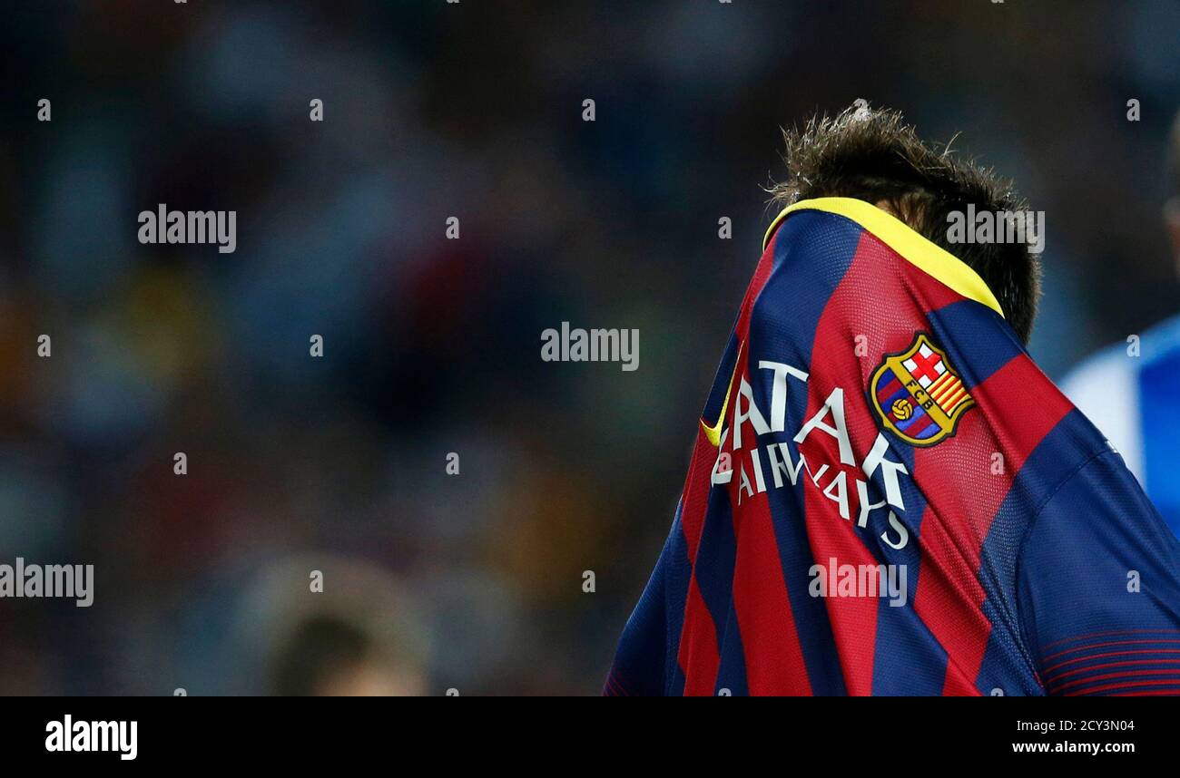 Barcelonas lionel messi covers face hi-res stock photography and images ...