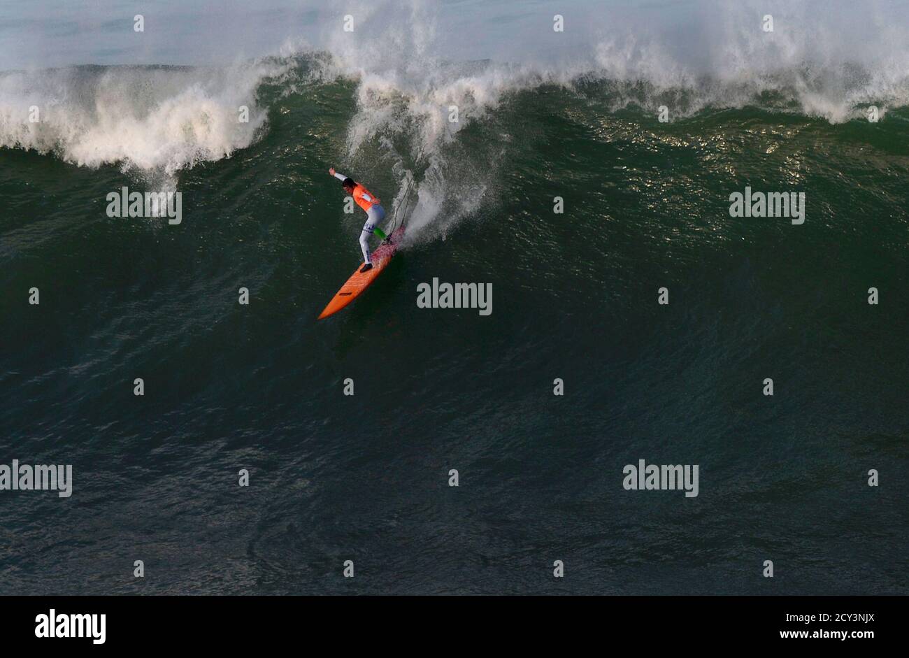 Big wave riders hi-res stock photography and images - Alamy