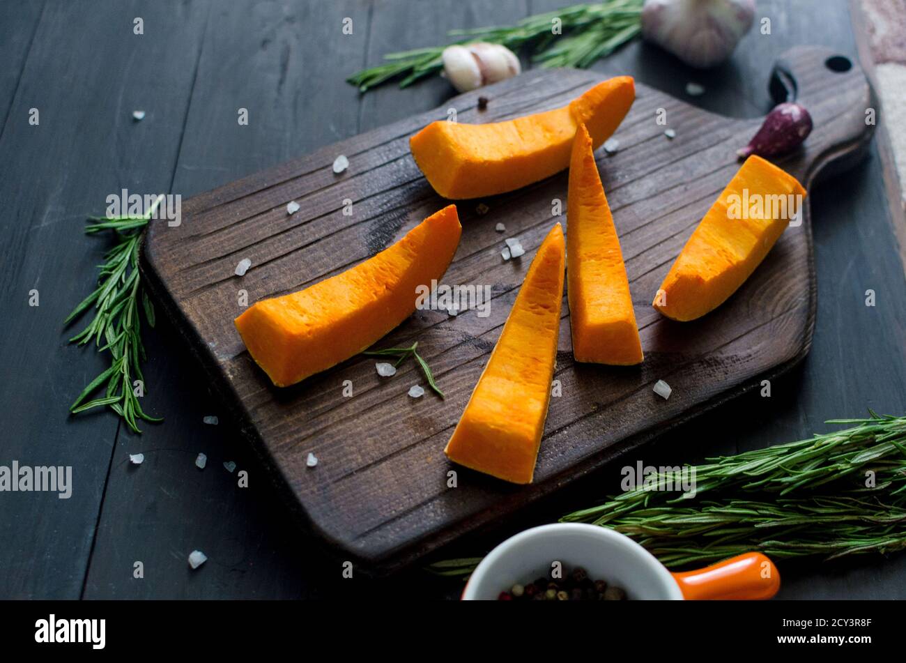 raw pieces of pumpkin prepared for baking in the oven Stock Photo - Alamy