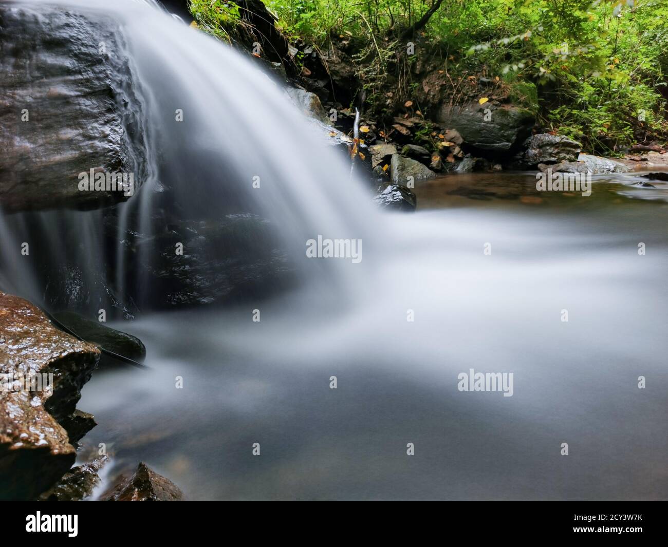 Silky waterfall in the forest, natural beauty Stock Photo - Alamy