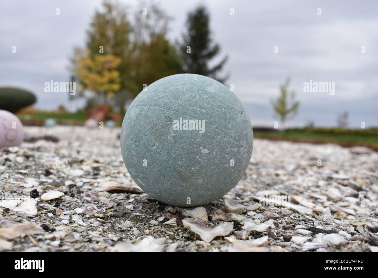 Closeup shot of a gray ball on the ground Stock Photo - Alamy