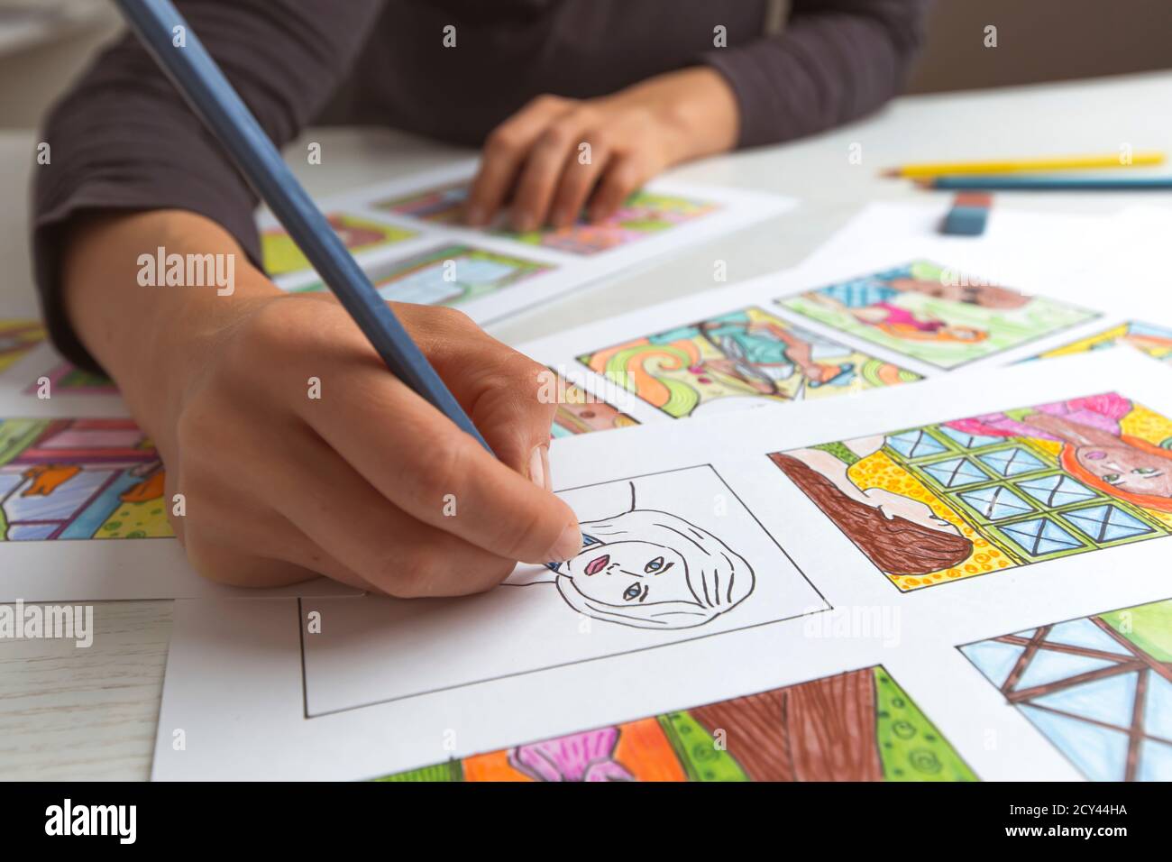 An animator painter draws a color storyboard for a comic book or movie ...