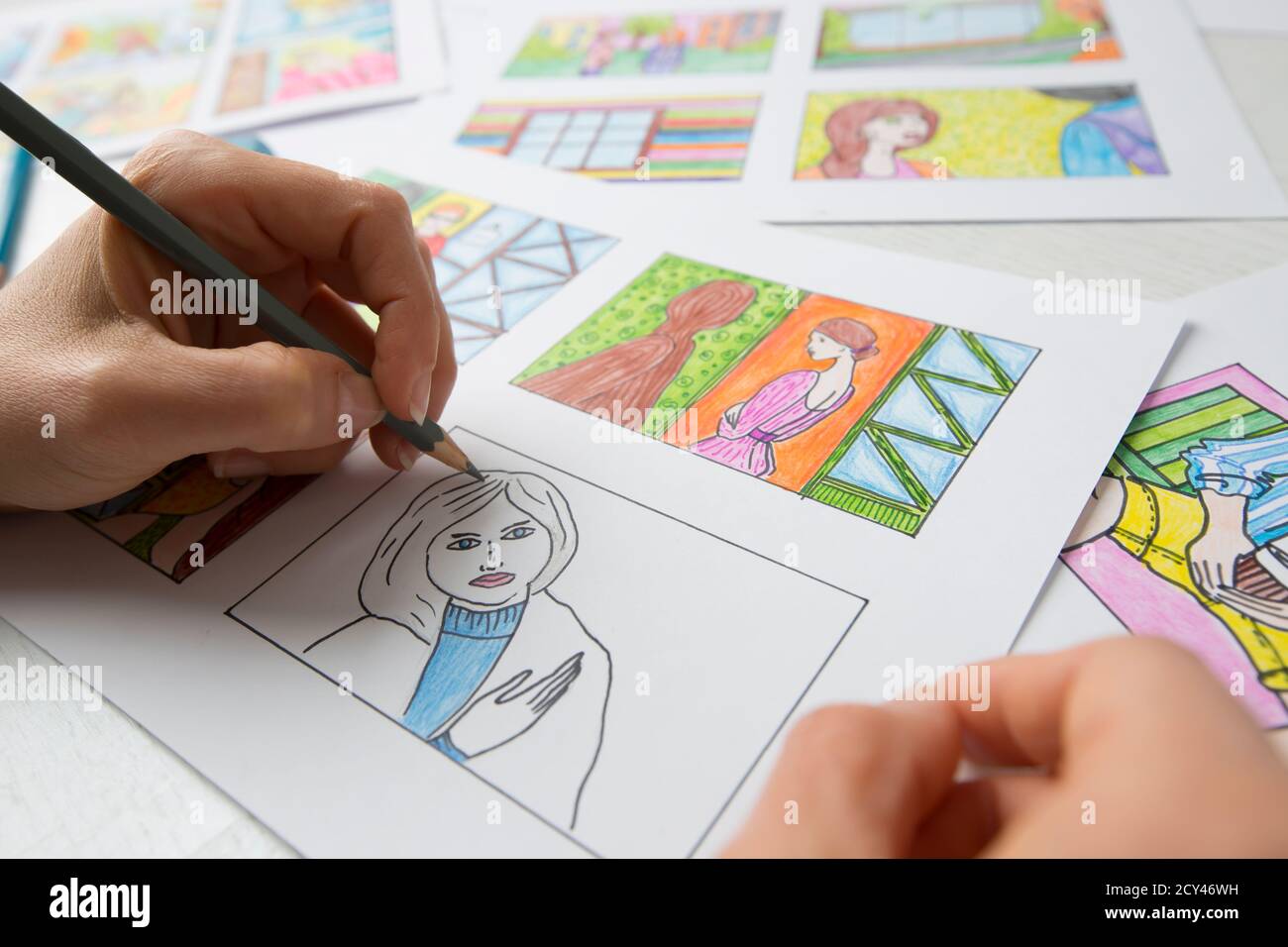 Drawing a colored storyboard. The illustrator creates comics on paper ...