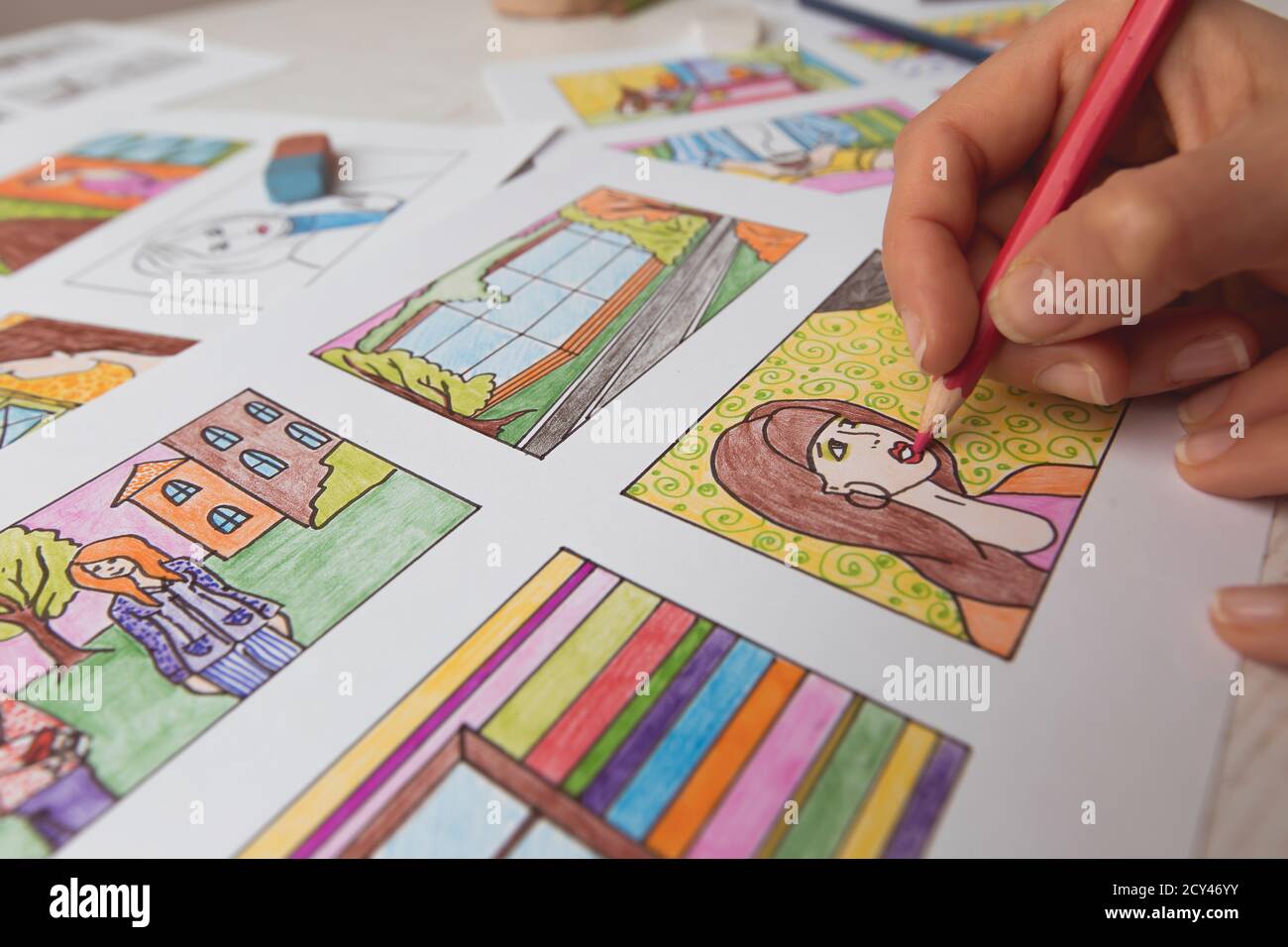 Drawing a colored storyboard. The illustrator creates comics on paper ...