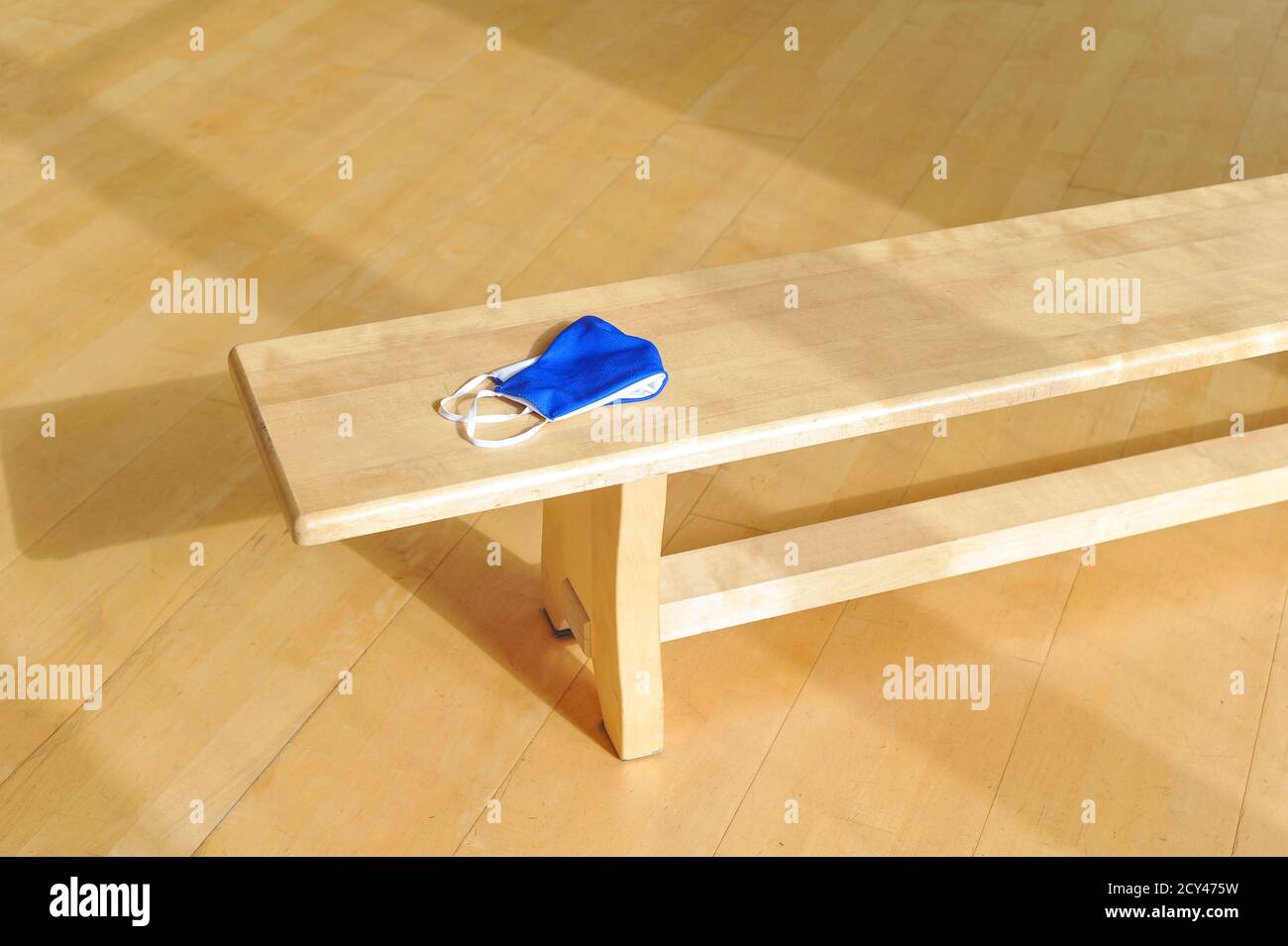 Blue protective mask on a bench in a physical education lesson. Safe ...