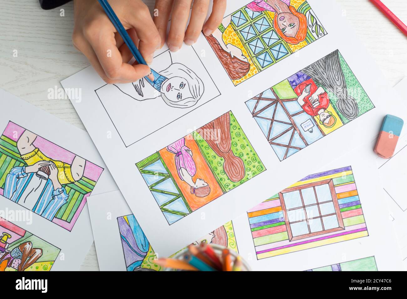 Drawing a colored storyboard. The illustrator creates comics on paper ...