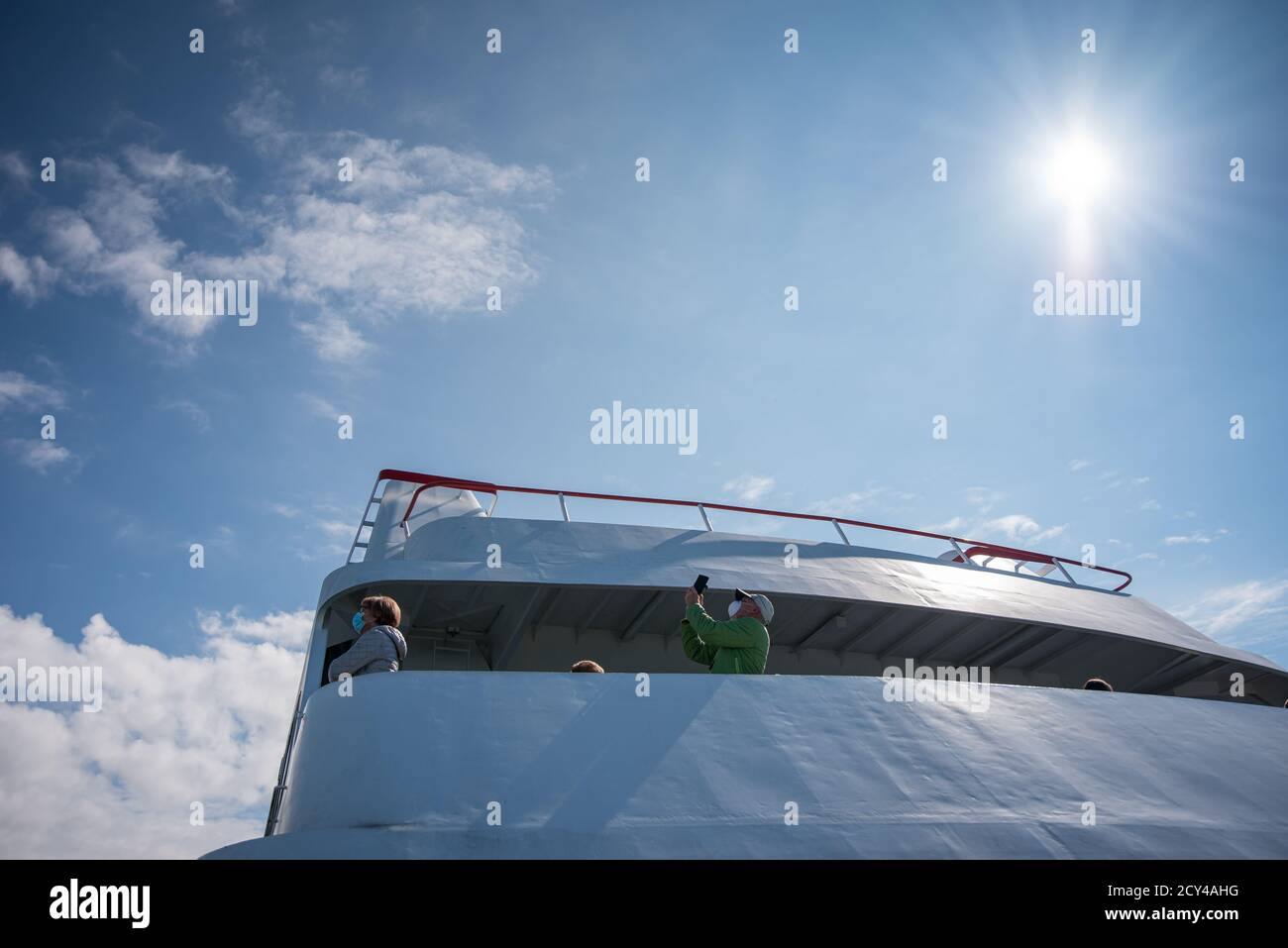 Tourists with face masks on cruise ship Stock Photo - Alamy