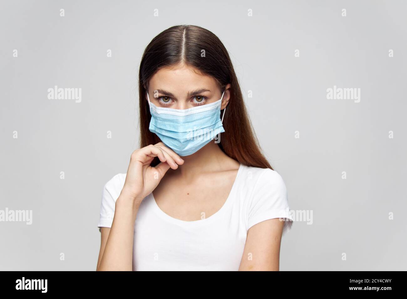 Pretty woman Medical mask on face look ahead white t-shirt protection ...