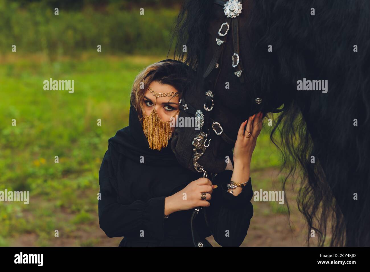 Muslim woman in hijab riding a horse Stock Photo - Alamy