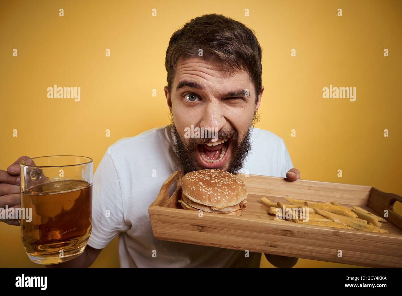 Bearded man with mug of beer fast food diet food fun alcohol lifestyle ...