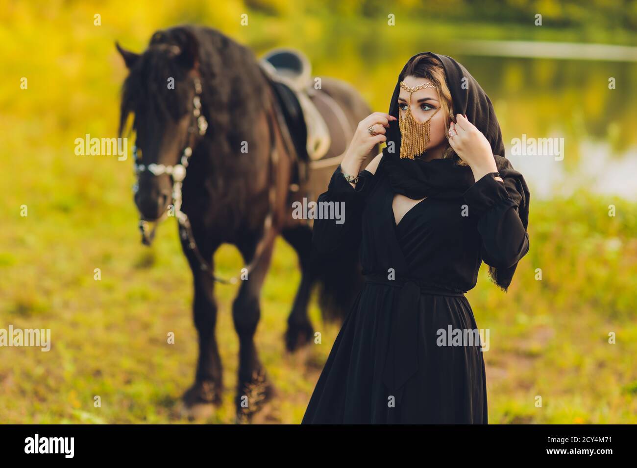 Muslim woman in hijab riding a horse Stock Photo - Alamy