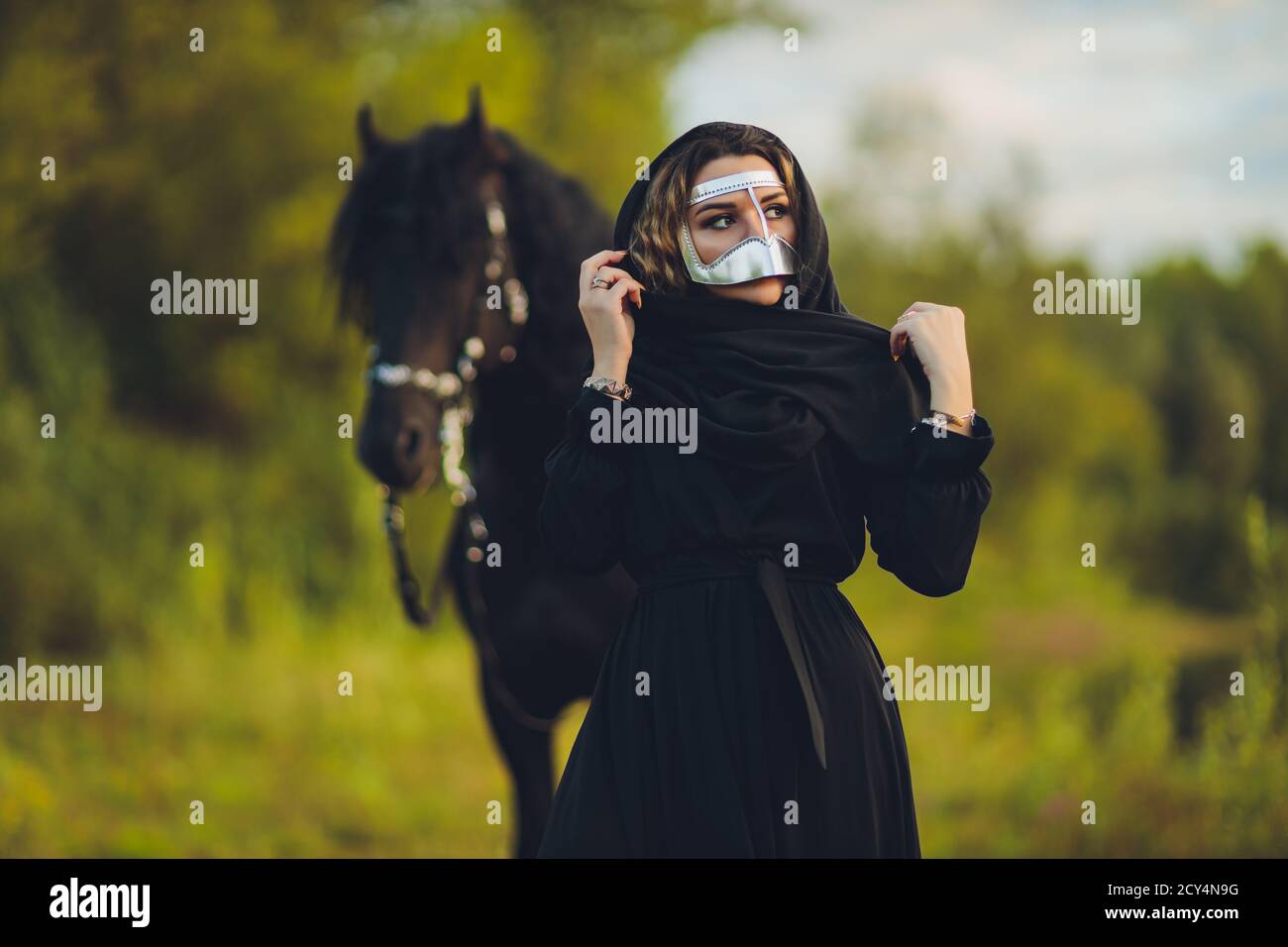 Muslim woman in hijab riding a horse Stock Photo - Alamy
