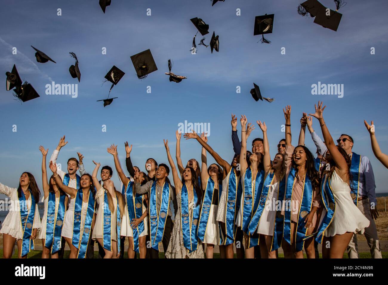 College graduates throwing cap usa hi-res stock photography and images ...