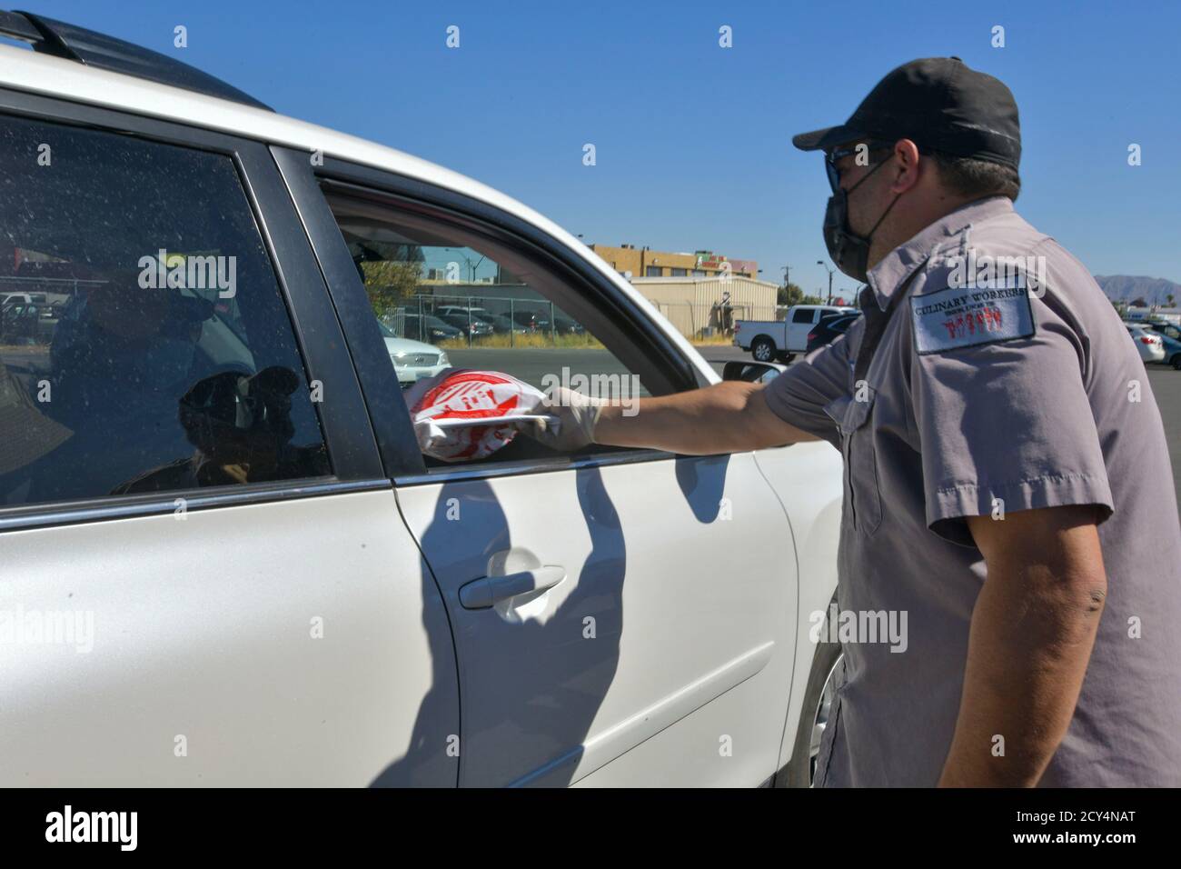 Handing out books hi-res stock photography and images - Alamy