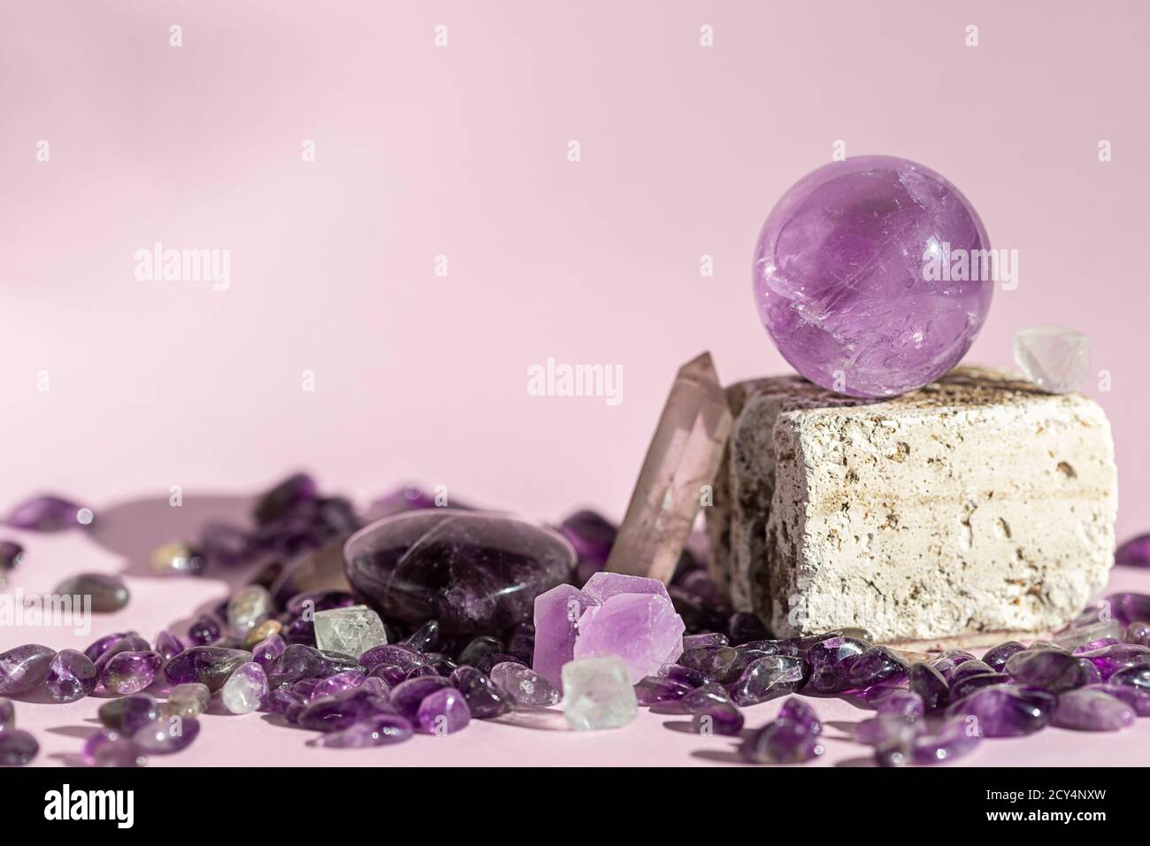 Crystal minerals for meditation on pink background. Magic Rock for ...