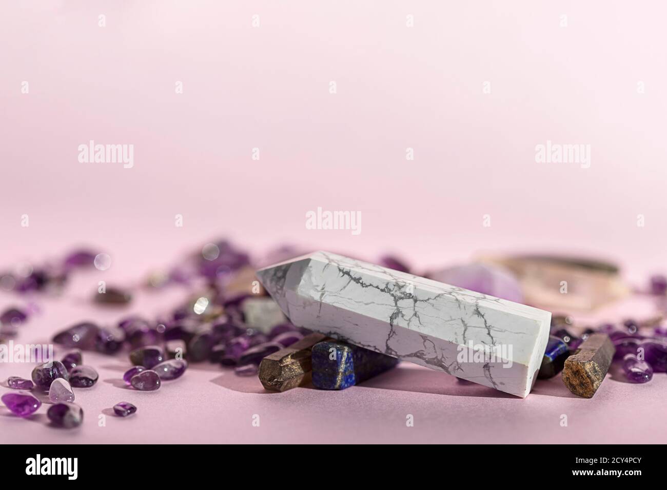 Crystal minerals for meditation on pink background. Magic Rock for ...