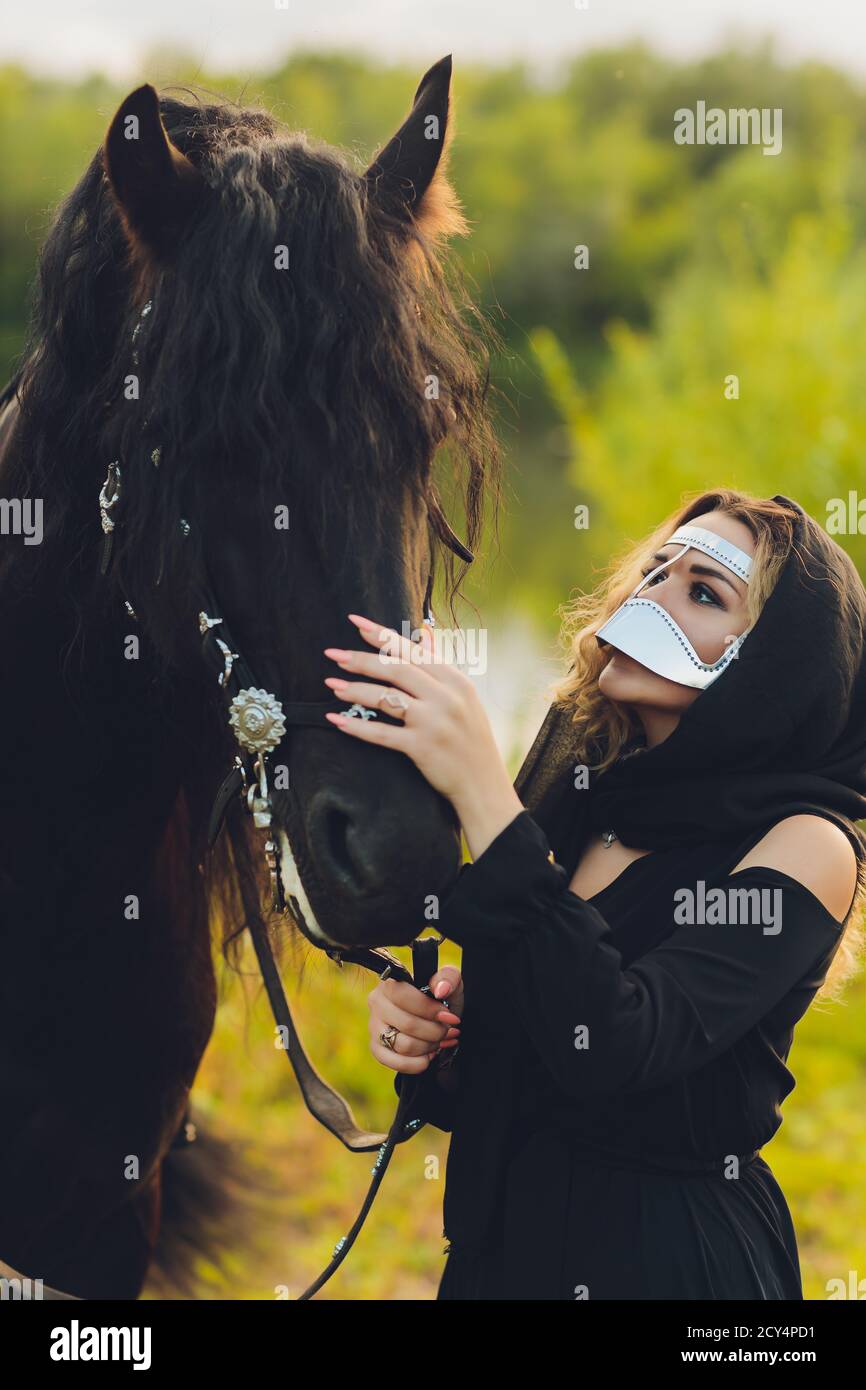 Muslim woman in hijab riding a horse Stock Photo - Alamy