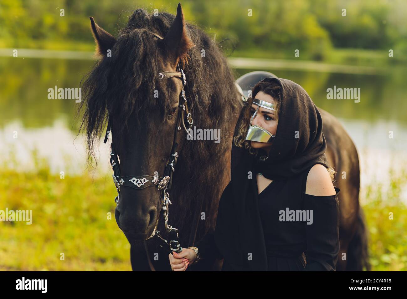 Muslim woman in hijab riding a horse Stock Photo - Alamy