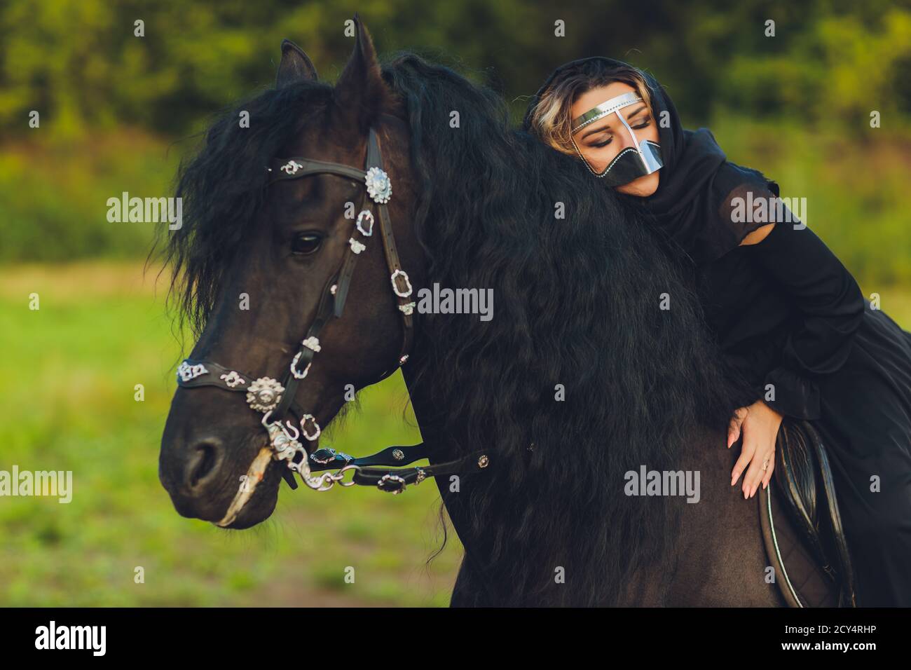 Muslim woman in hijab riding a horse Stock Photo - Alamy