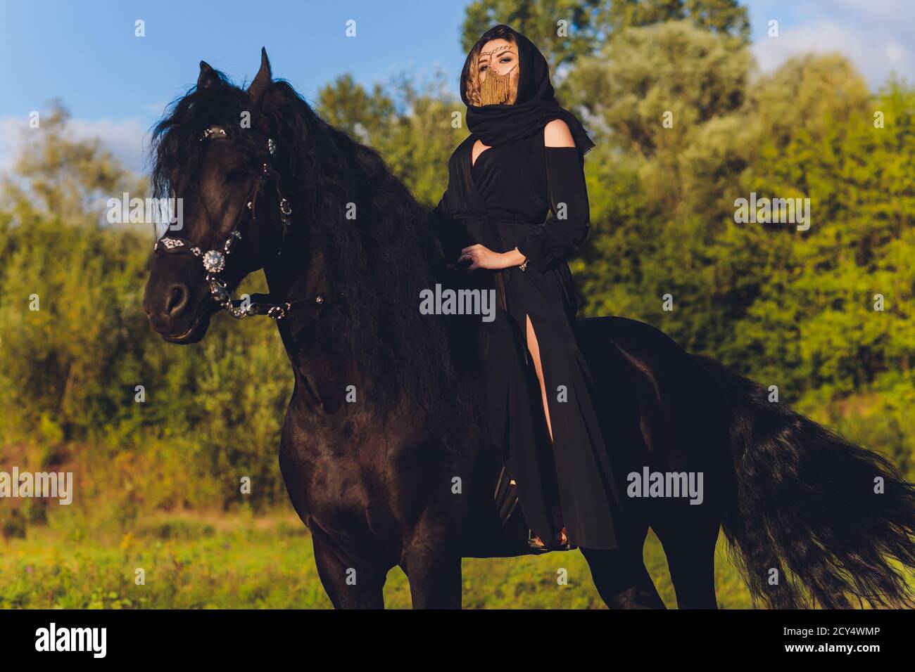 Muslim woman in hijab riding a horse Stock Photo - Alamy