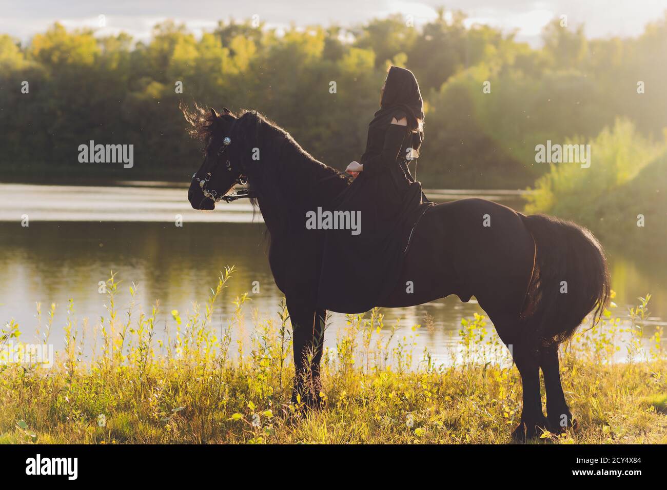 Muslim woman in hijab riding a horse Stock Photo - Alamy