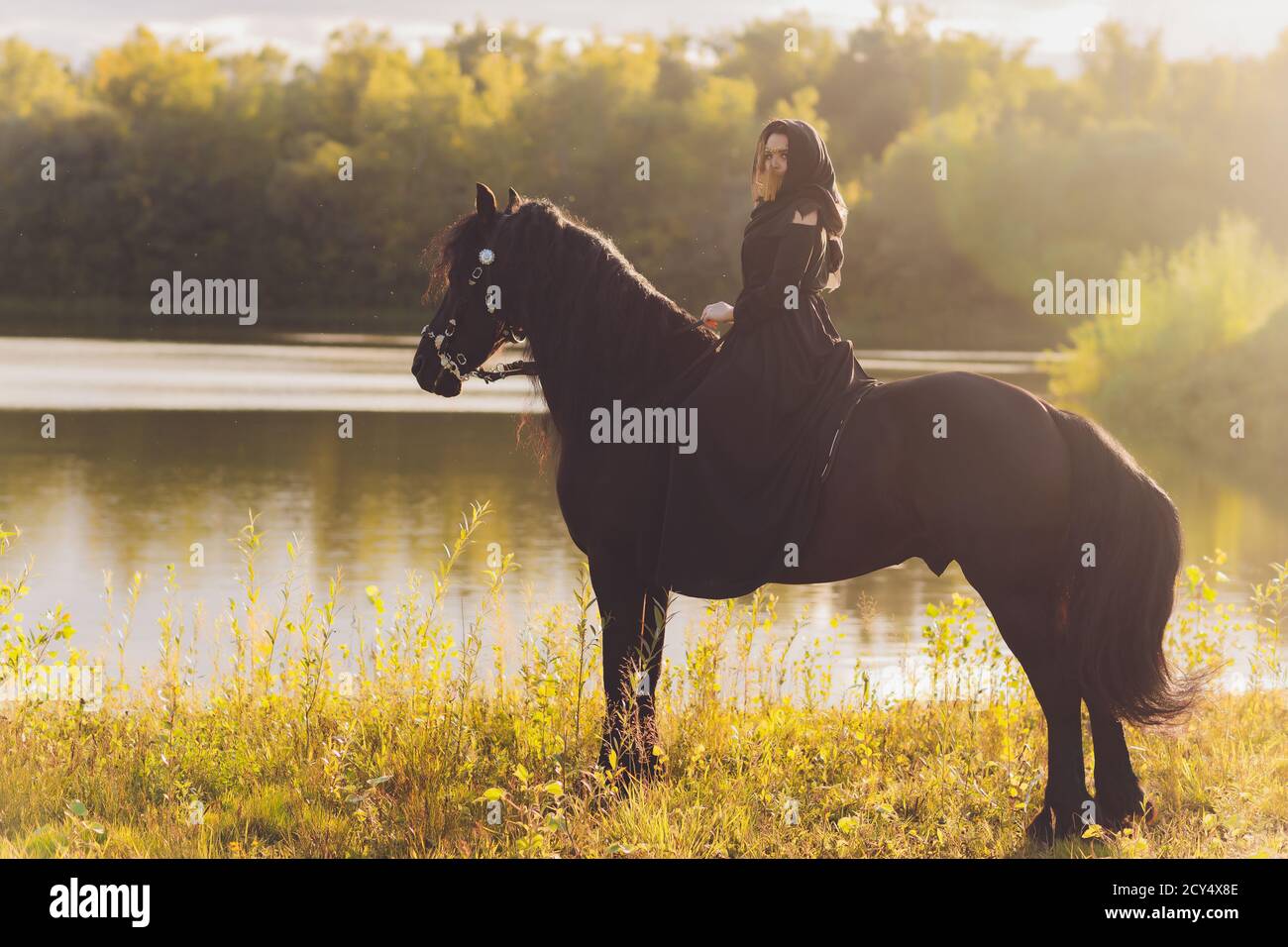 Muslim woman in hijab riding a horse Stock Photo - Alamy