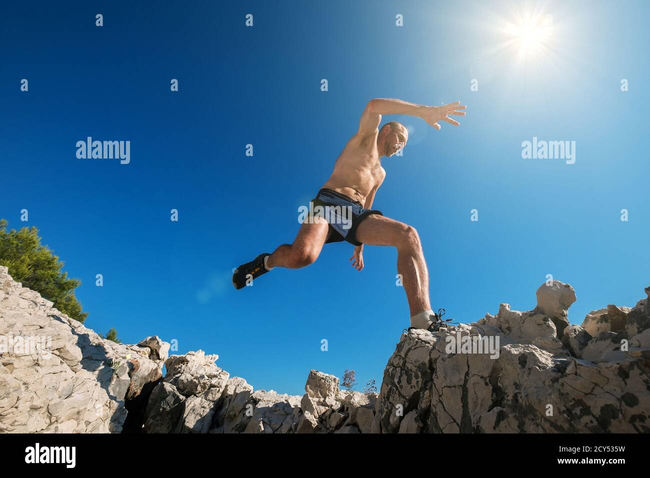 Muscular body jump hi-res stock photography and images - Alamy