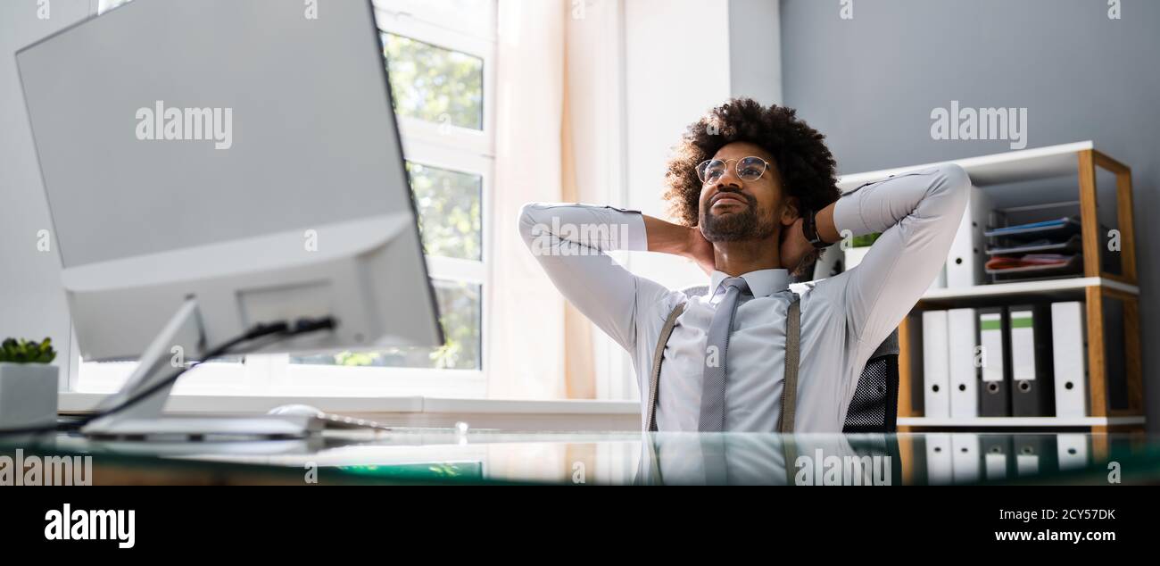 Successful African Businessman Leaning Back. Happy Employee Stock Photo ...