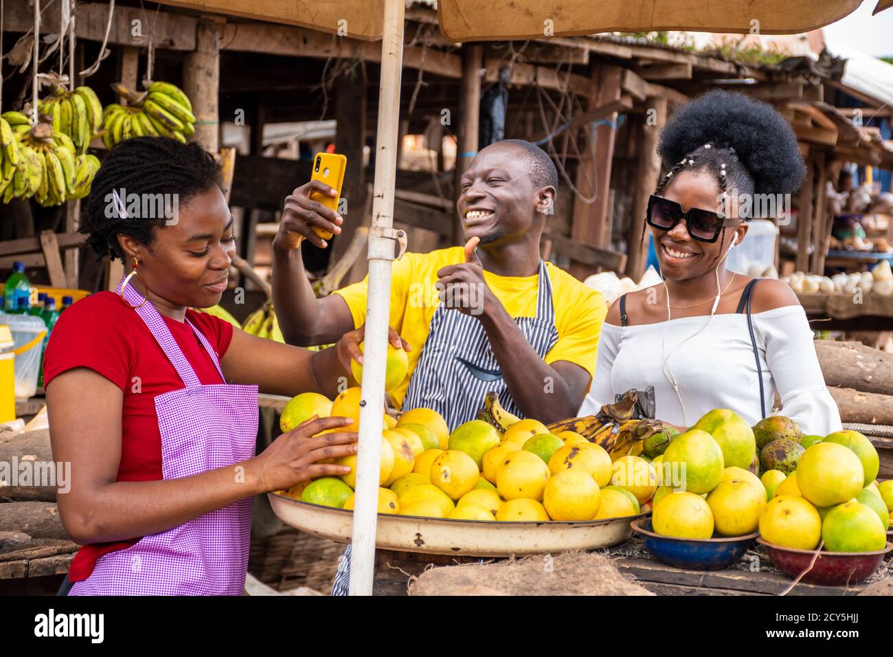 young african trader gives a thumbs up while doing a video call in a ...