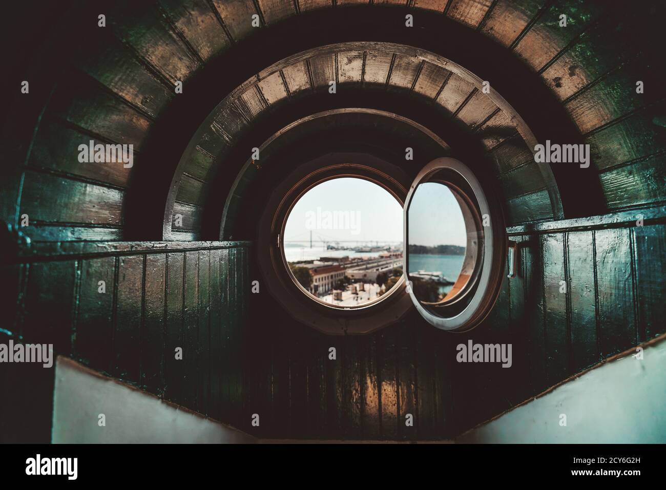 A wide-angle view of a wooden arc in a nook recess of a house with a ...