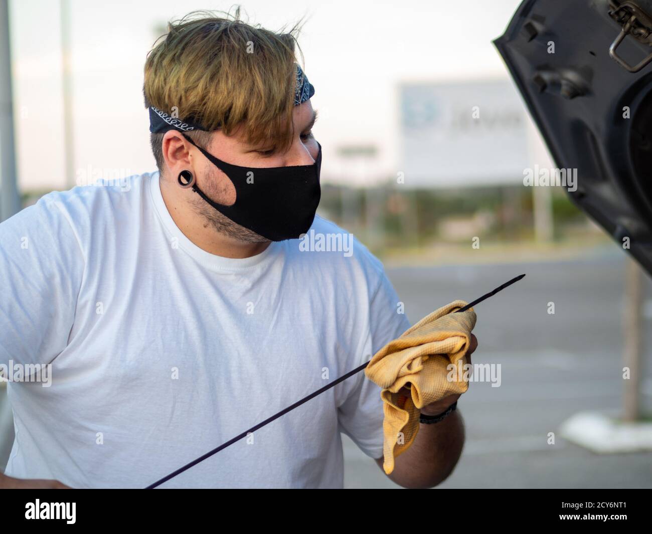 Male cleaning a wire with a mop Stock Photo - Alamy