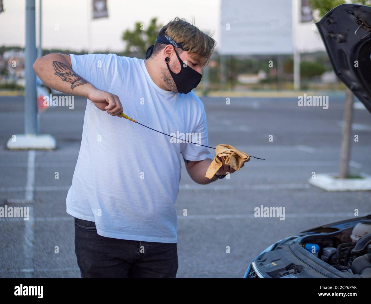 Male cleaning a wire with a mop Stock Photo - Alamy