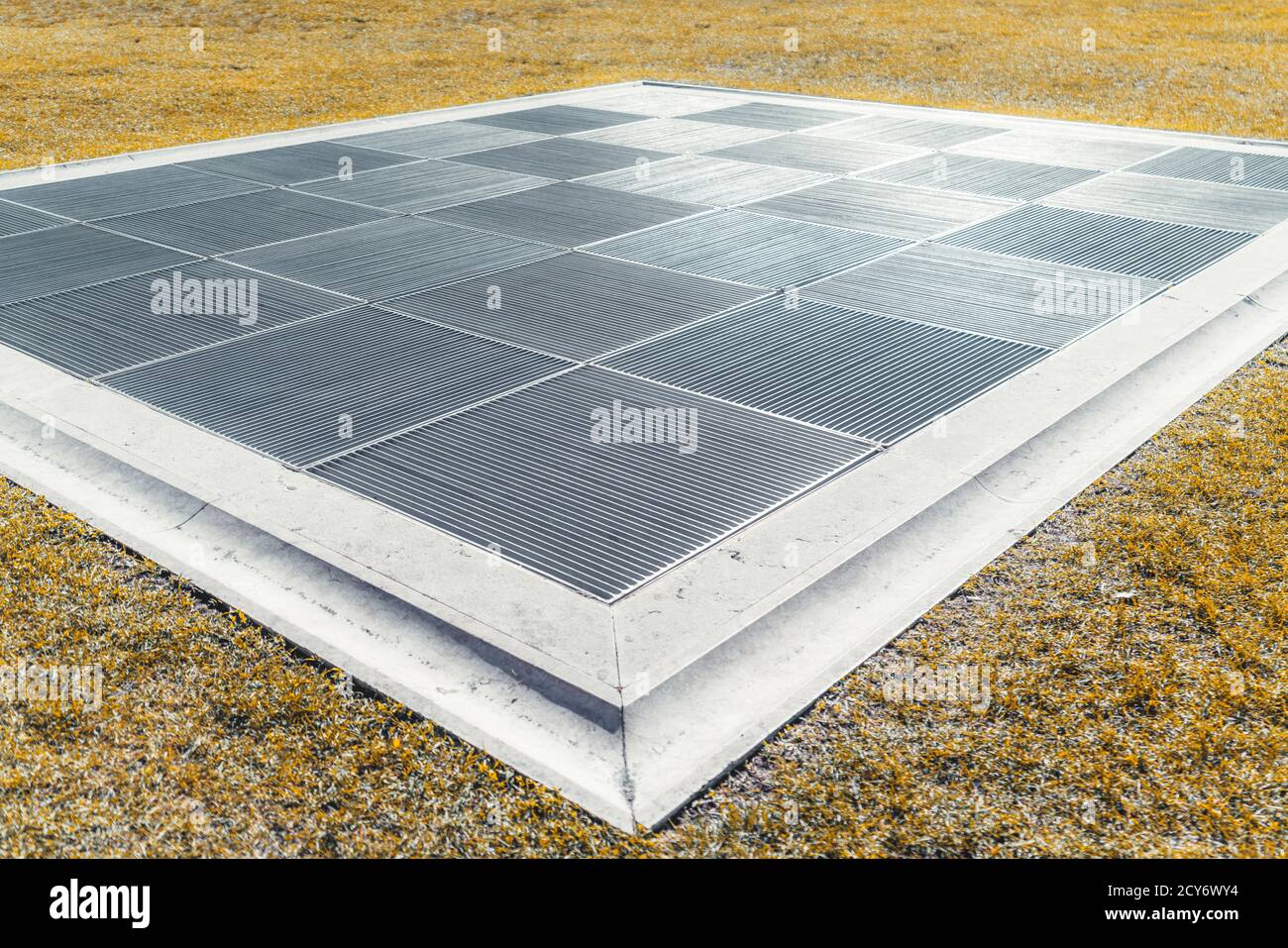 Wide-angle view of a huge rectangular air shaft outdoors leading to ...