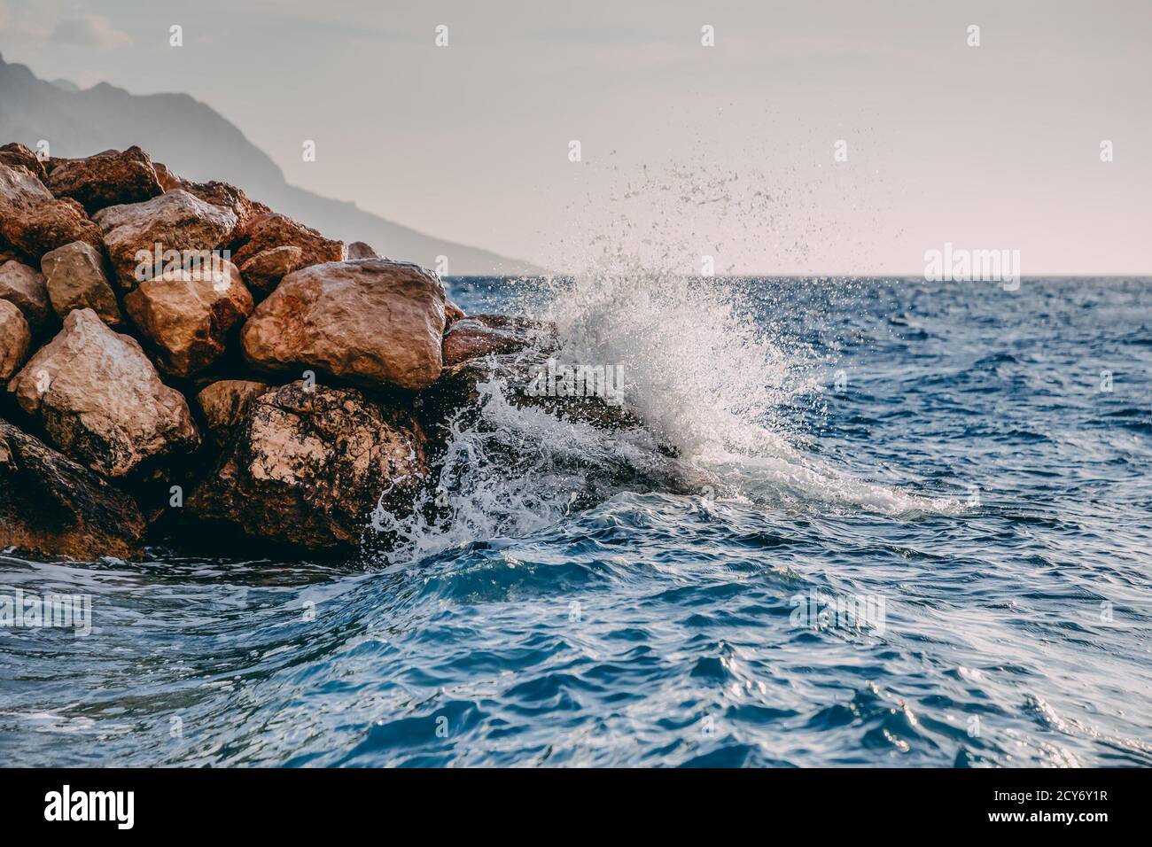Beautiful blue waves hit rocky hi-res stock photography and images - Alamy