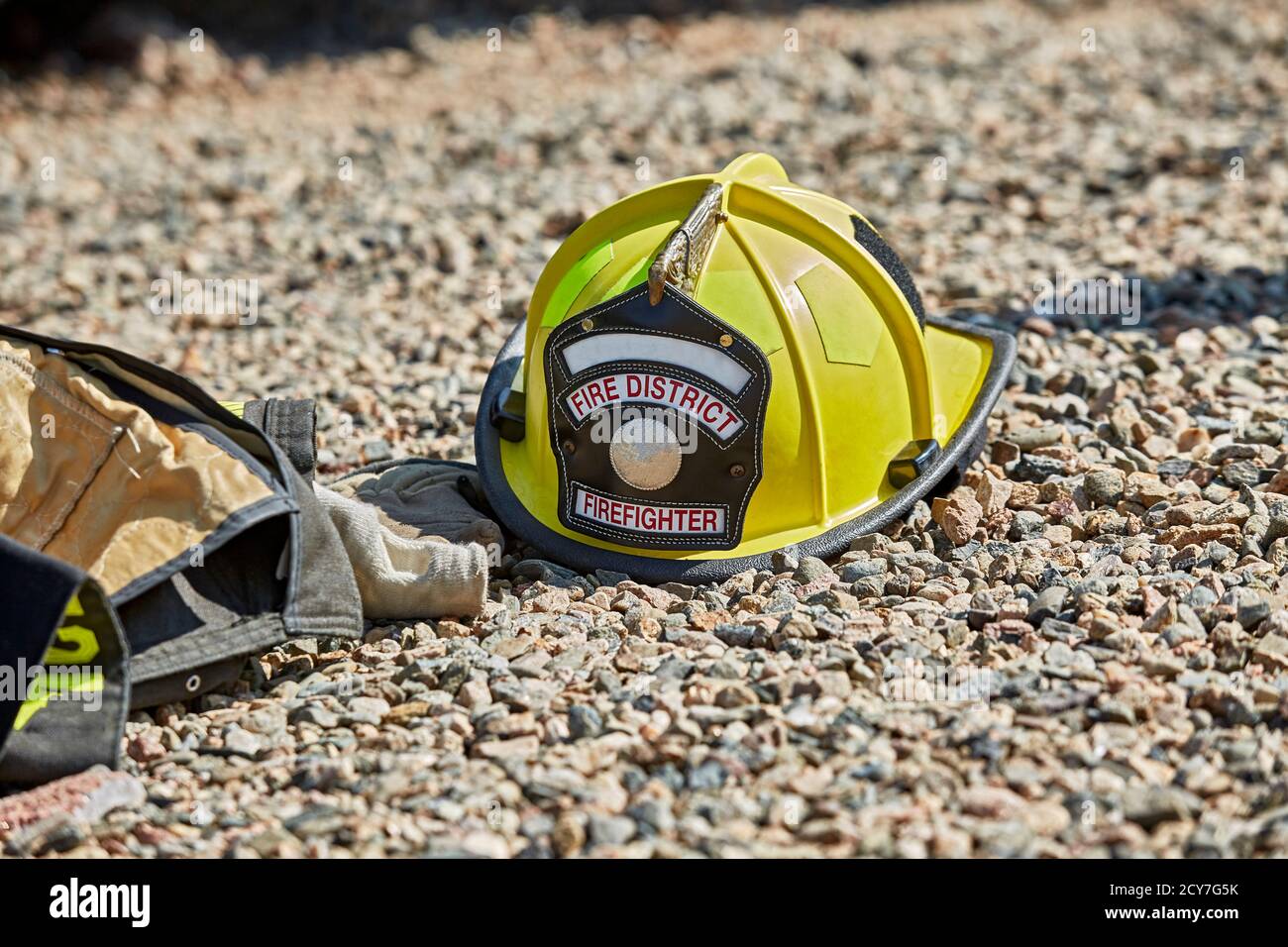 Firefighter helmet and jacket on the ground after practicing rescue ...