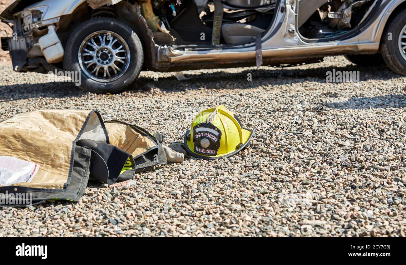 Firefighter helmet and jacket on the ground after practicing rescue ...