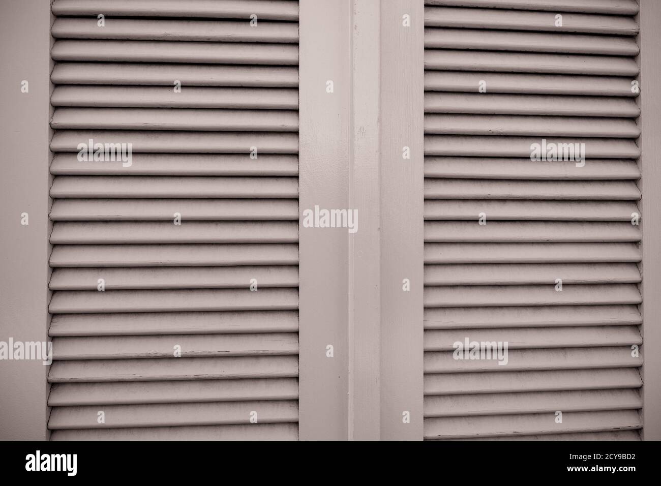 Double shutters on a white window Stock Photo - Alamy