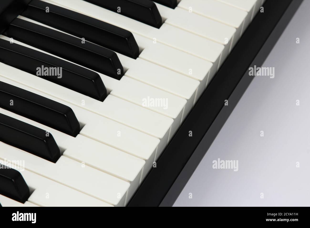 the piano keys closeup on white background Stock Photo - Alamy