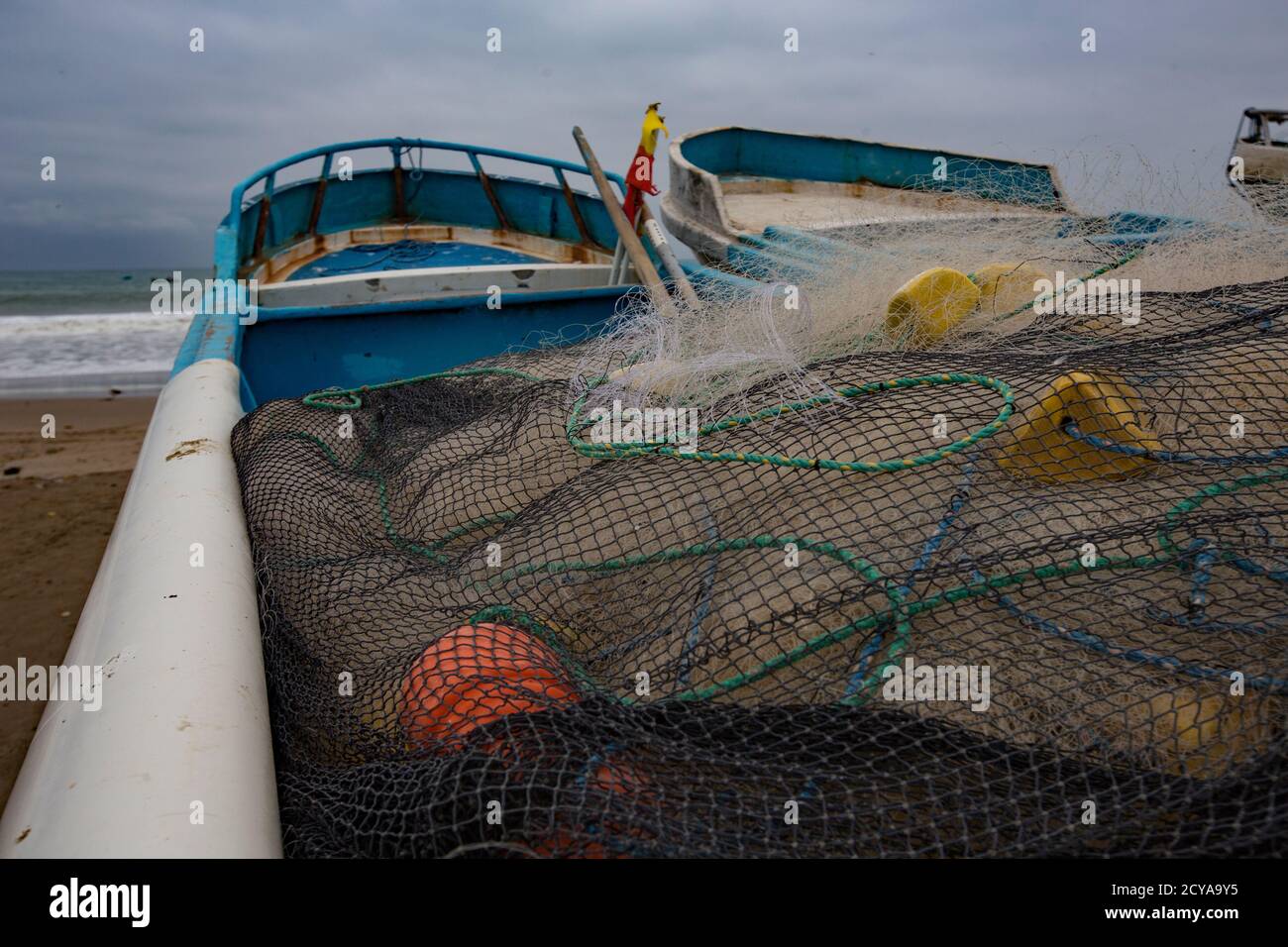Fishing nets lay in boat, watiing to be used early the next morning in ...