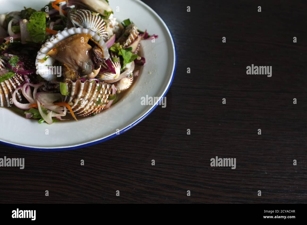 Thai street food , Spicy blood cockle salad Stock Photo - Alamy