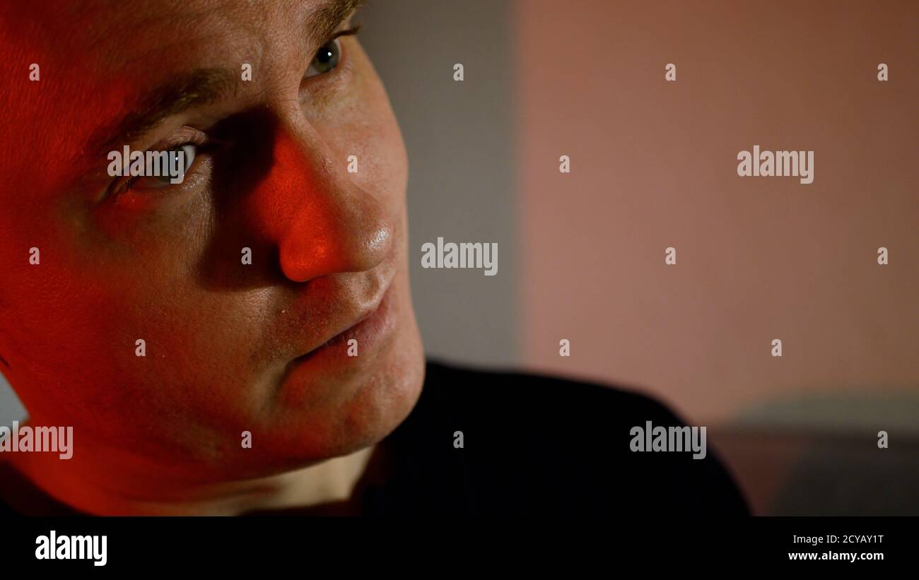 Angry eyes face in shadow hi-res stock photography and images - Alamy