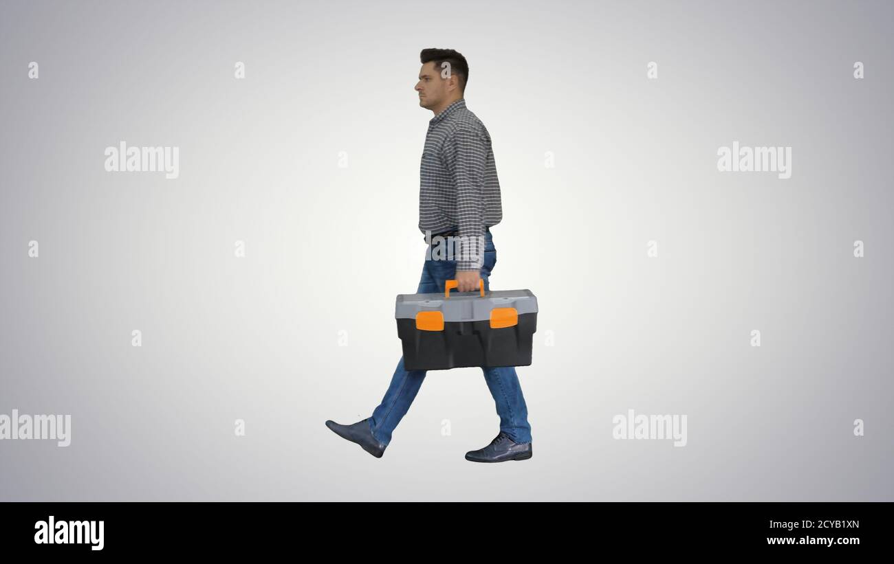 Professional repairman concept Handyman walking with tool case o Stock ...